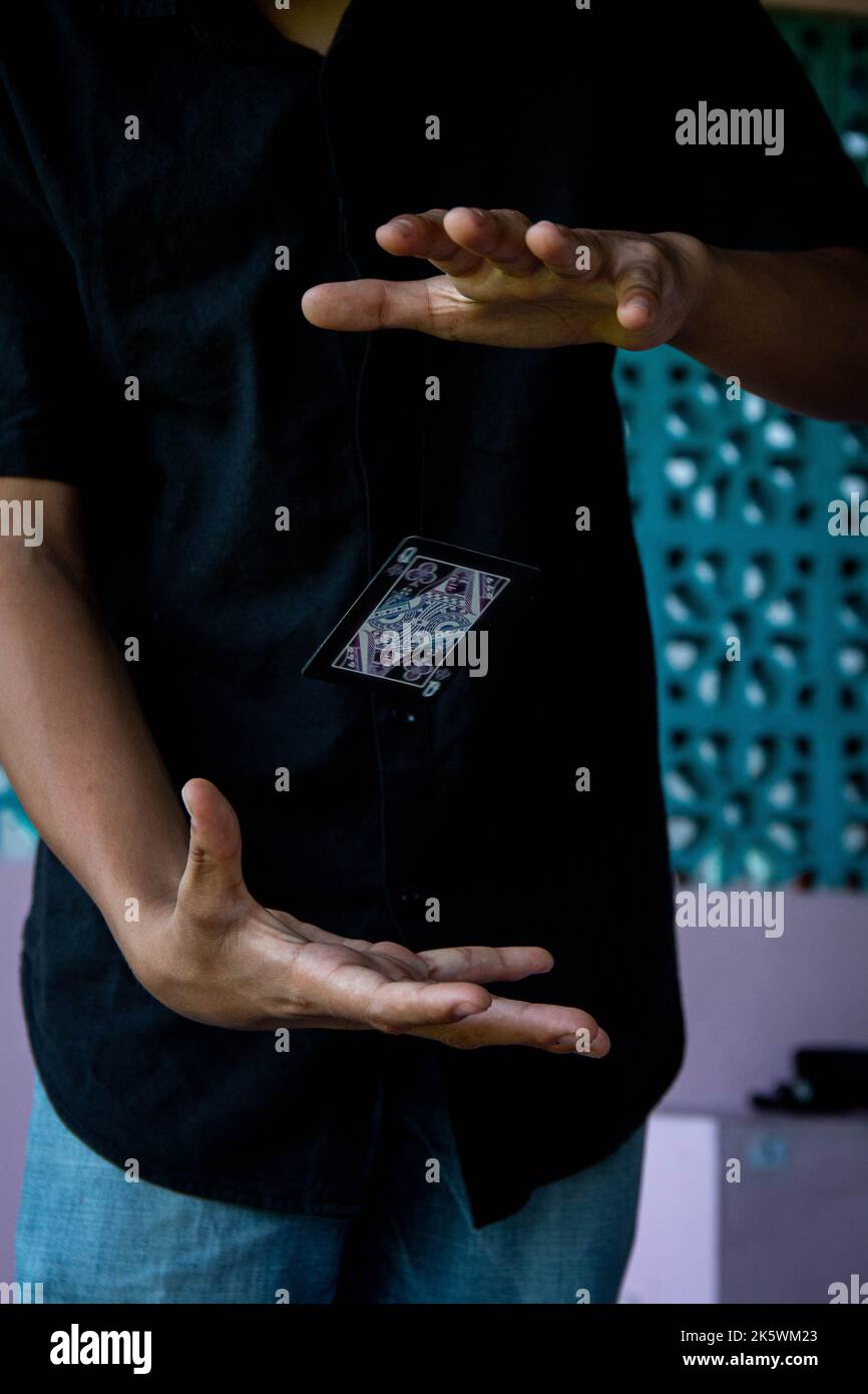 Man showing tricks with cards hi-res stock photography and images - Alamy