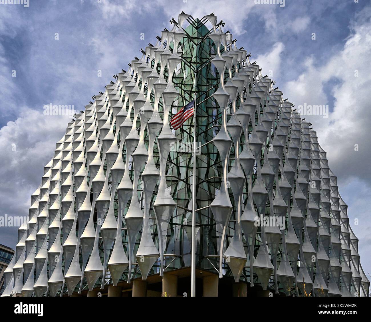 A low angle shot of the American Embassy of London under the cloudy sky ...