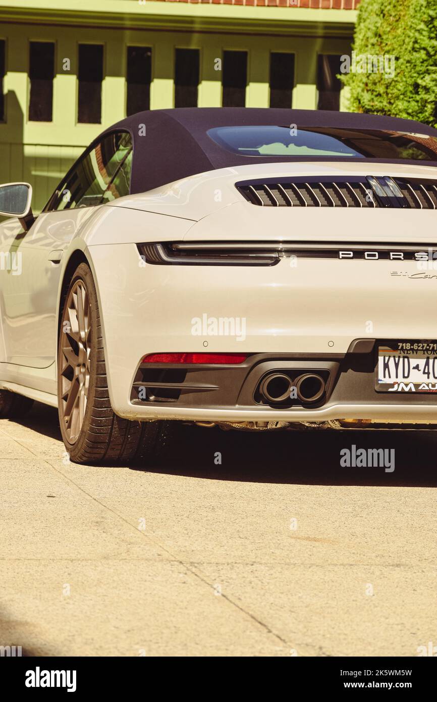 A vertical of the back of a white Porsche 911 Carrera 4S in Brooklyn ...