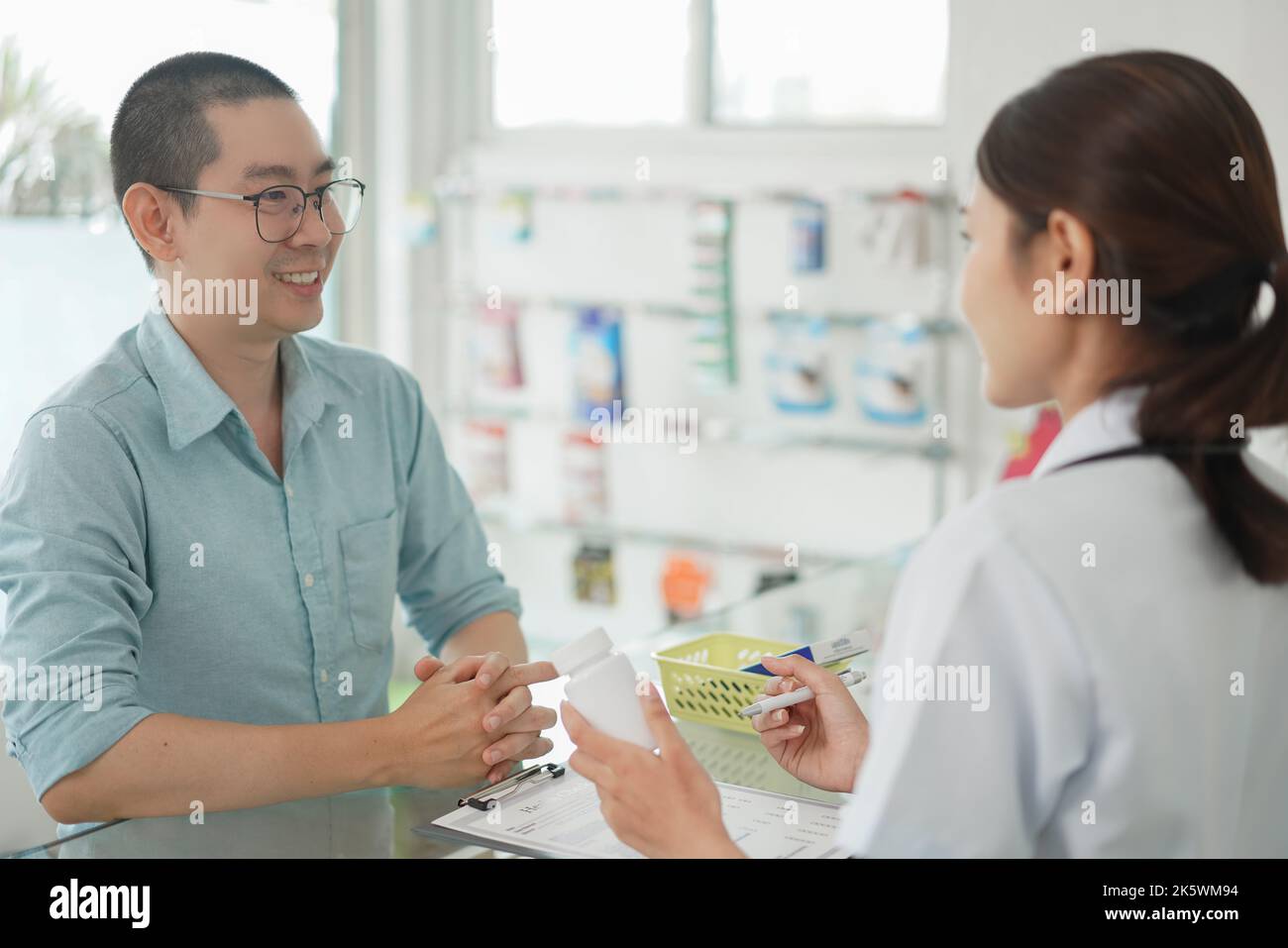 Pharmacist patient medication explain hi-res stock photography and ...