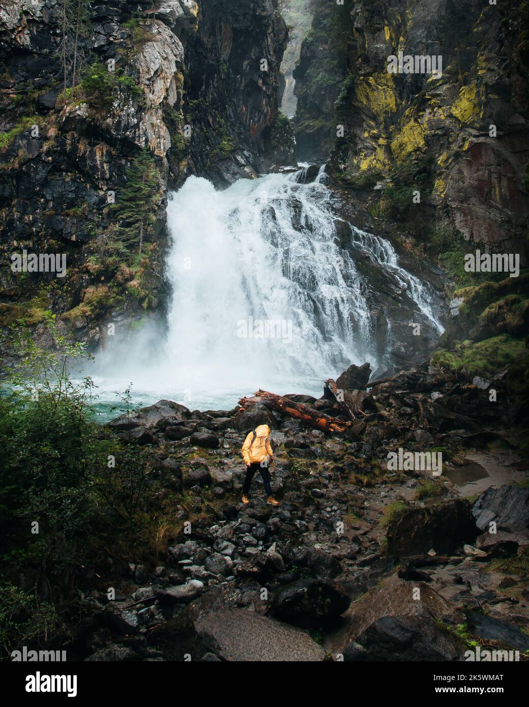landscape photo of Riva waterfall at Dolomites with a brave hiker ...