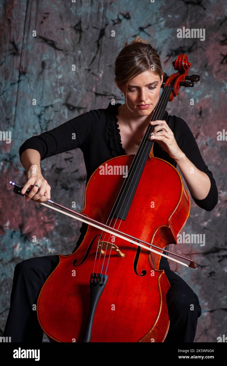 Cello player cellist hands playing hi-res stock photography and images ...