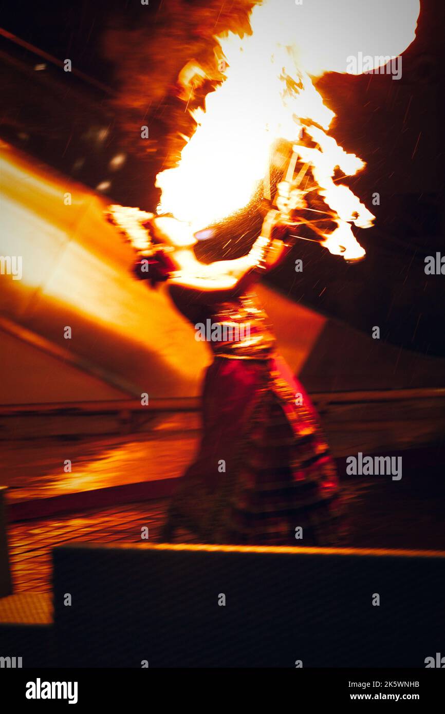 A female with fire hoops during fire show Stock Photo - Alamy