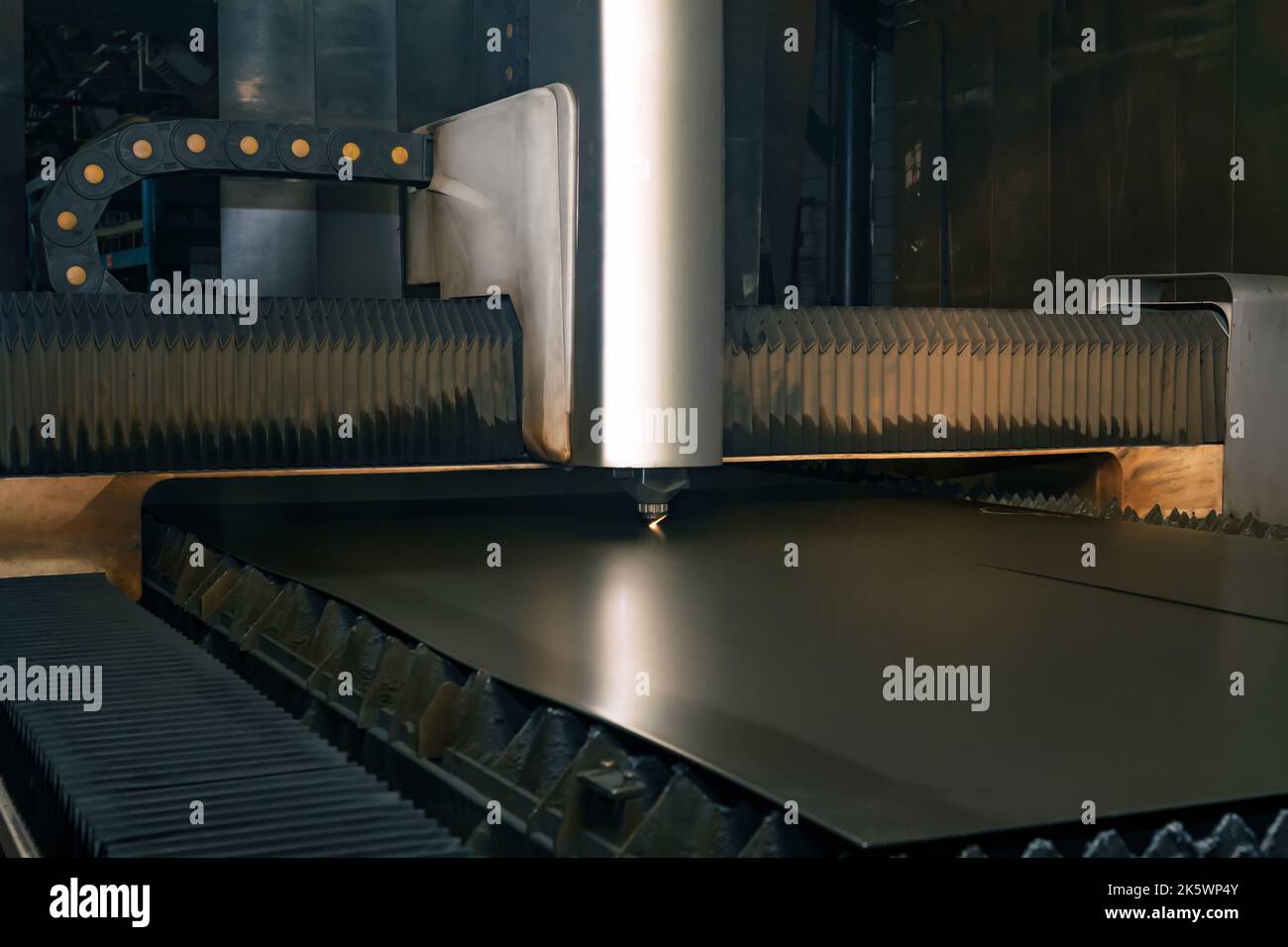 heavy industrial laser cutter during metal sheet processing Stock Photo ...