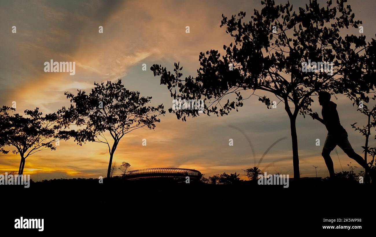 Fitness silhouette sunrise jogging workout wellness concept Stock Photo ...