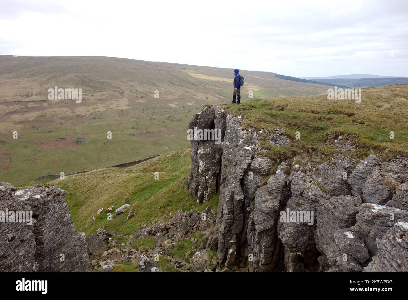 Lone Man Standing on Crag Looking Down the Valley of Langstrothdale ...