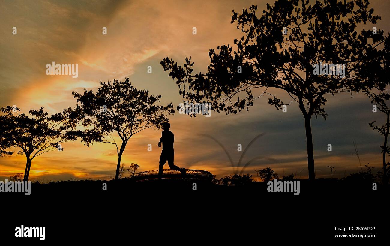 Fitness silhouette sunrise jogging workout wellness concept Stock Photo ...