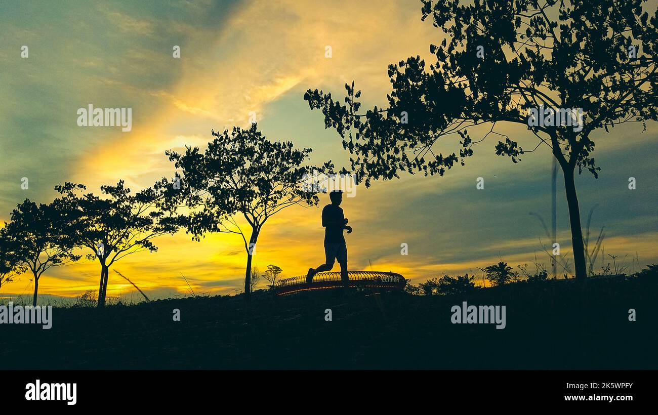 Fitness silhouette sunrise jogging workout wellness concept Stock Photo ...