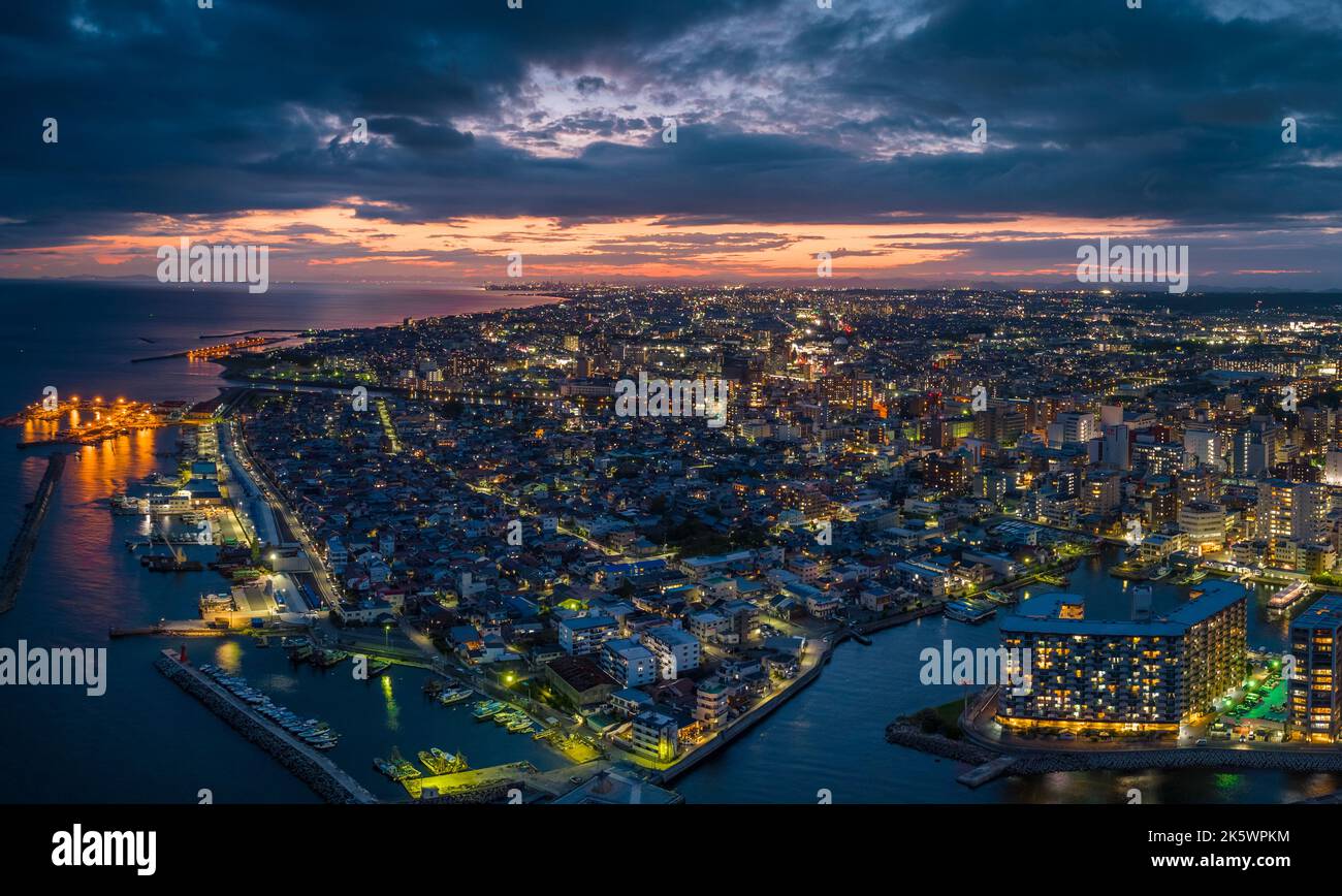 Aerial view of small harbor on waterfront city at night Stock Photo - Alamy