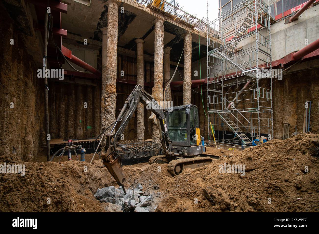 Construction site basement excavation with temporary propping, concrete ...