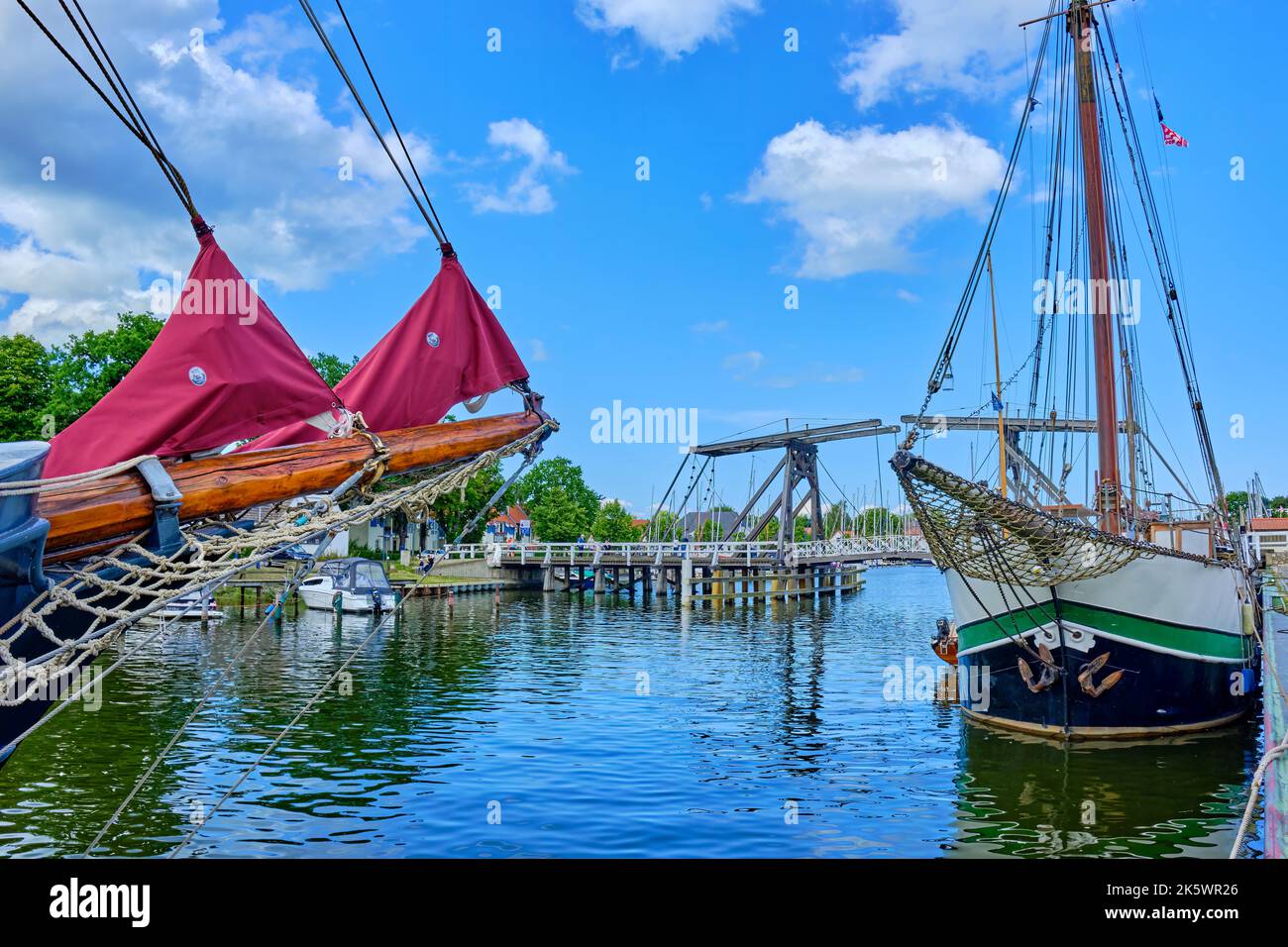 Bowsprits and bows of two sailing ships in front of the picturesque ...