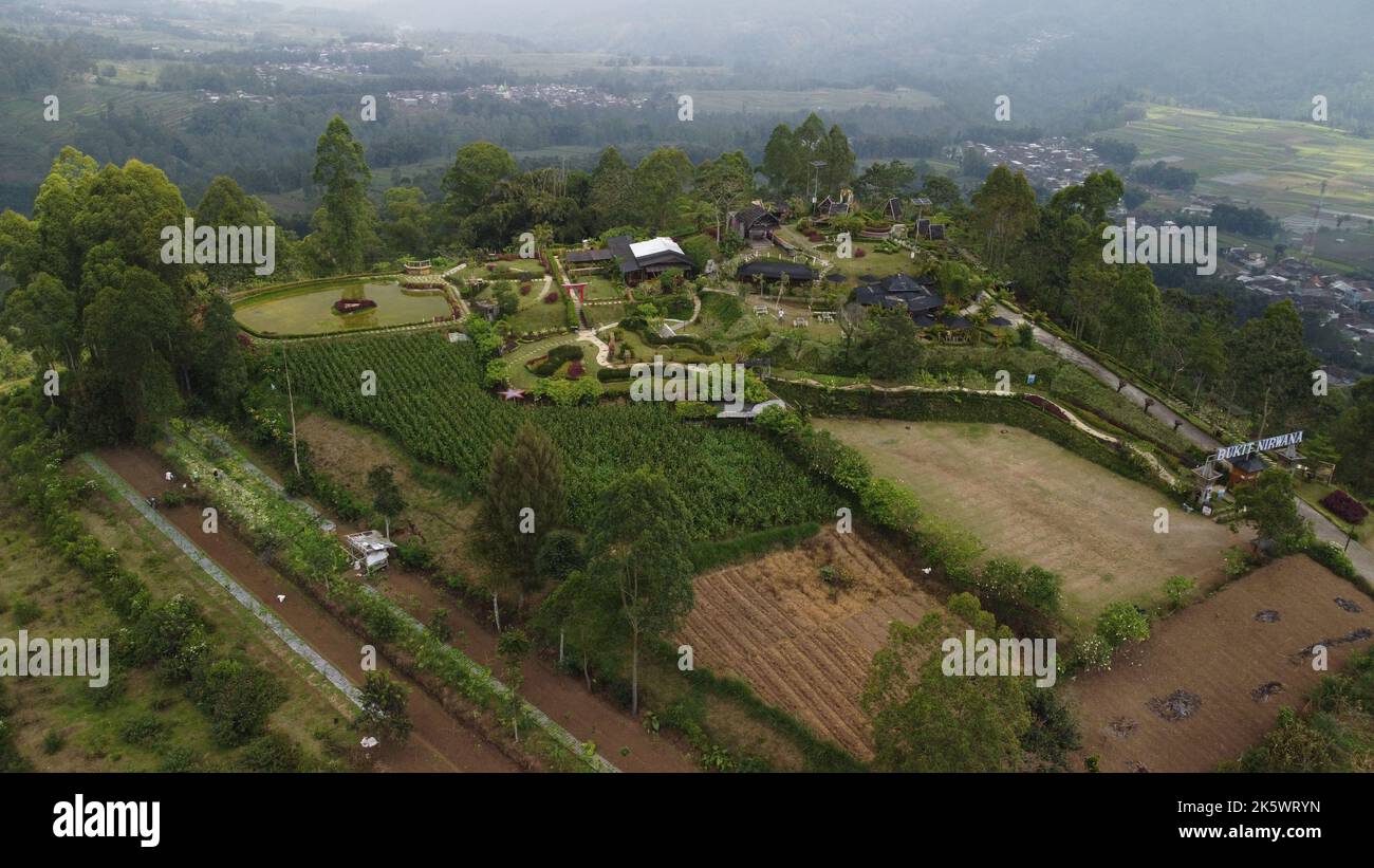 A high-angle shot of the Java island trees and buildings in Indonesia ...