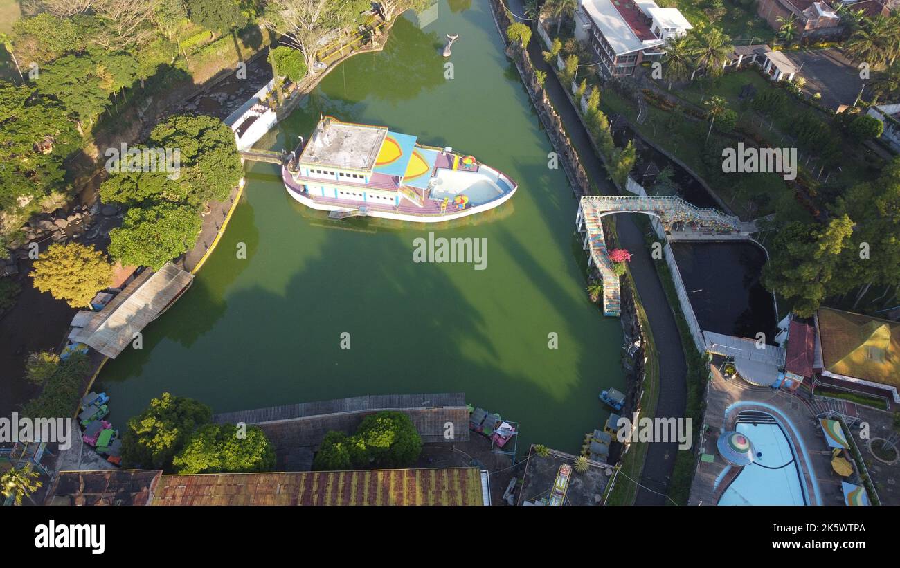 A high-angle shot of the Sengkaling waterpark with a colorful boat in ...