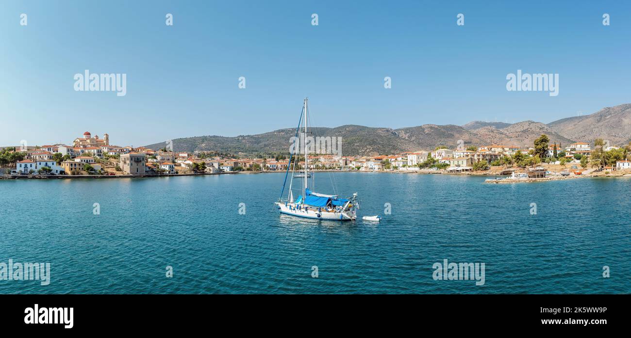 Galaxidi Greece, sunny day. Sailboat anchored on calm sea, traditional ...