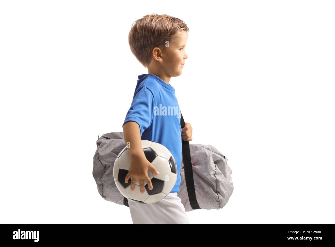 Soccer training child carrying ball hi-res stock photography and images ...