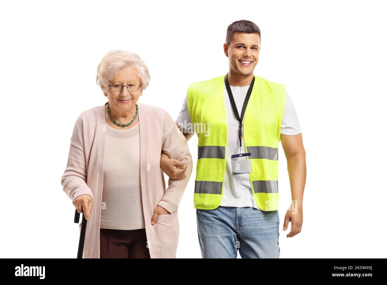 Young male community worker helping an elderly lady isolated on white ...