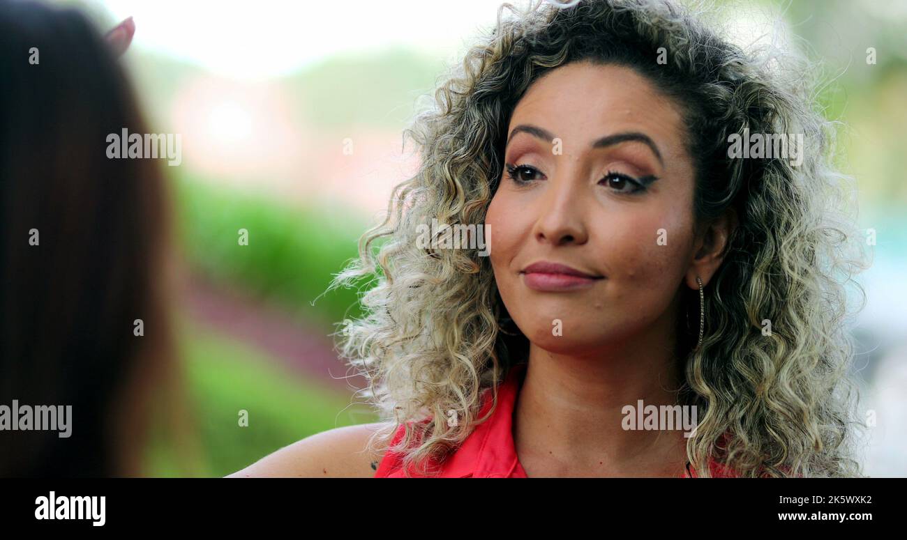 Woman nodding yes in affirmation while talking to friend Stock Photo ...