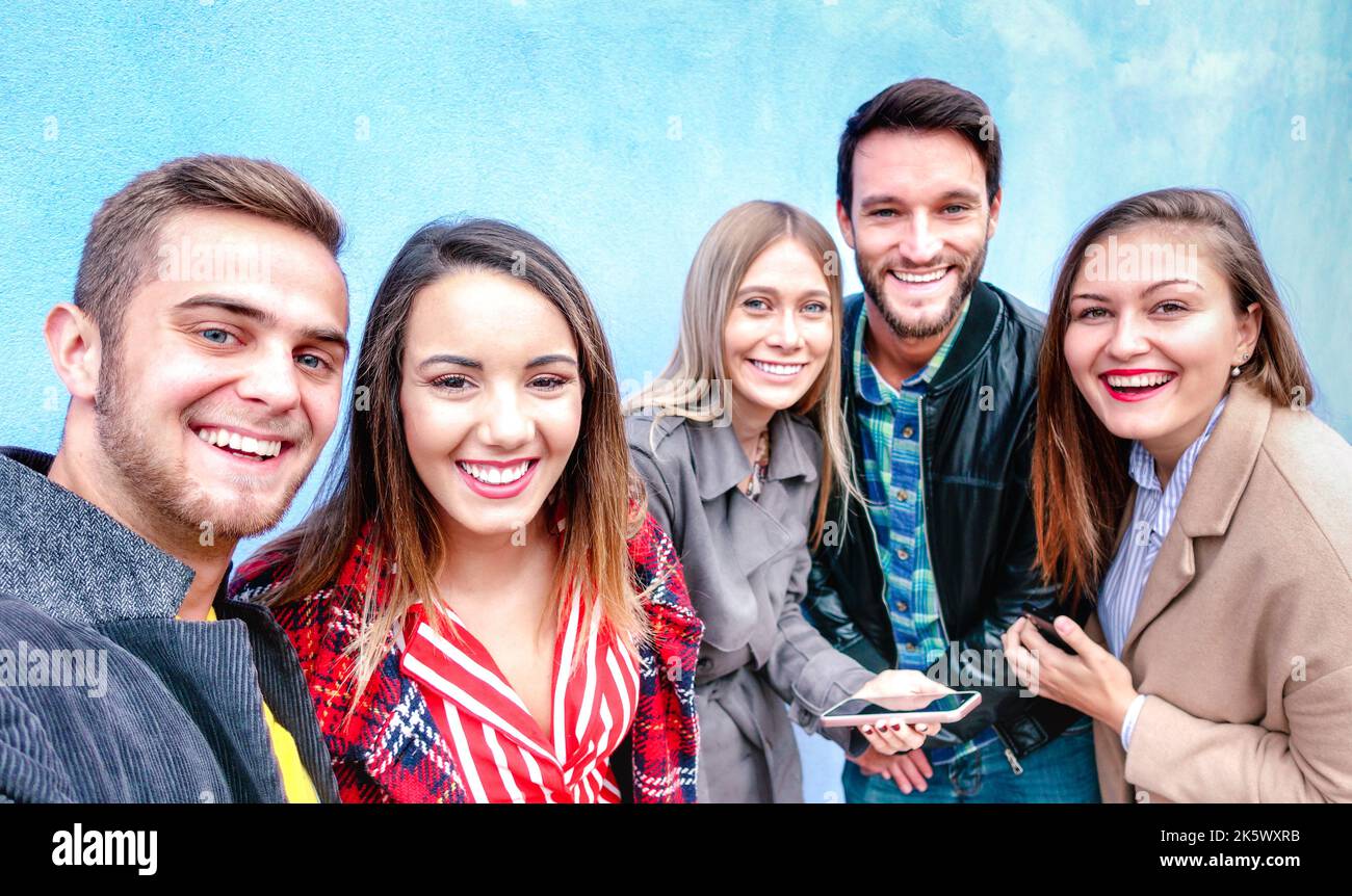 Best friends taking selfie wearing four seasonal clothes - Happy ...