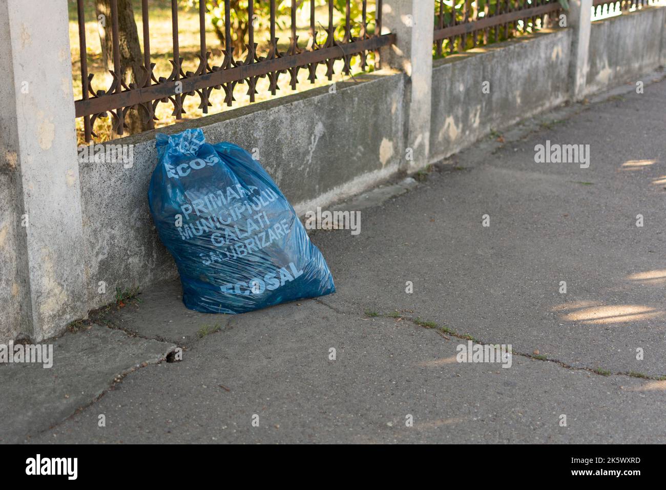 Galați, Romania - September 14, 2022: Plastic trash bag on the sidewalk ...