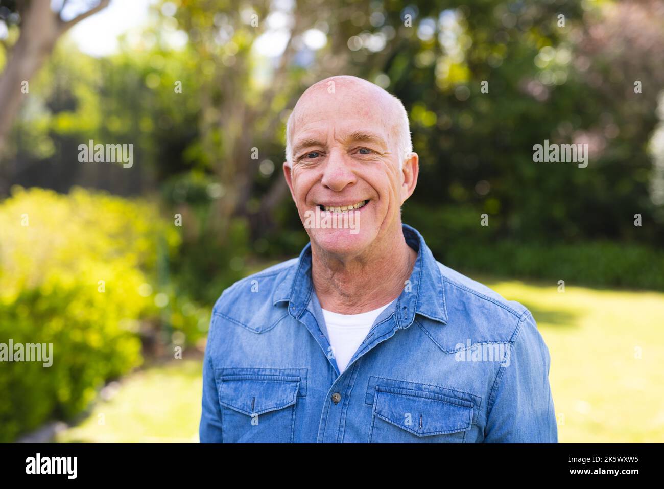 Portrait of senior caucasian men wearing blue shirt and standing in the ...