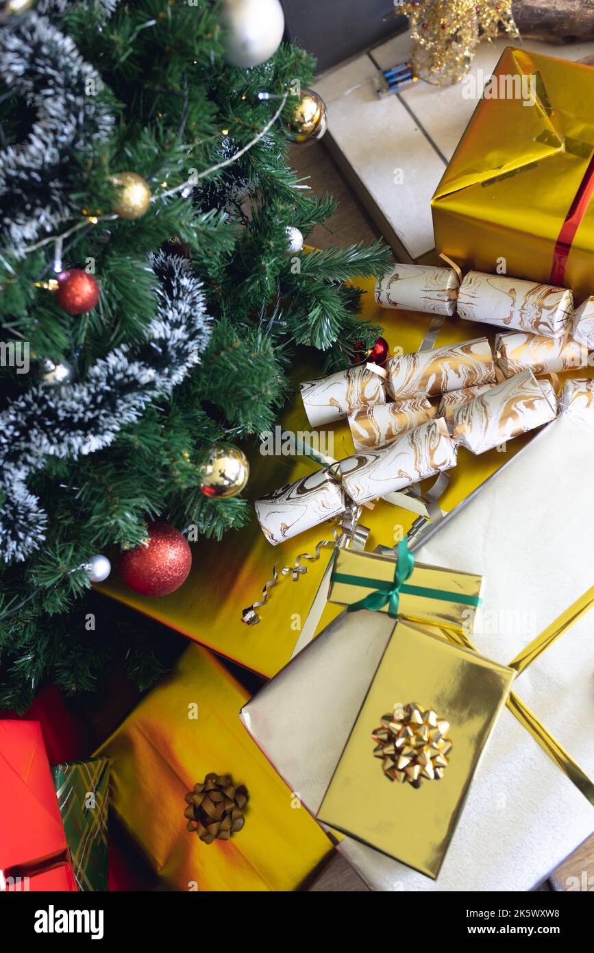 Many different colorful christmas presents with ribbons under the ...