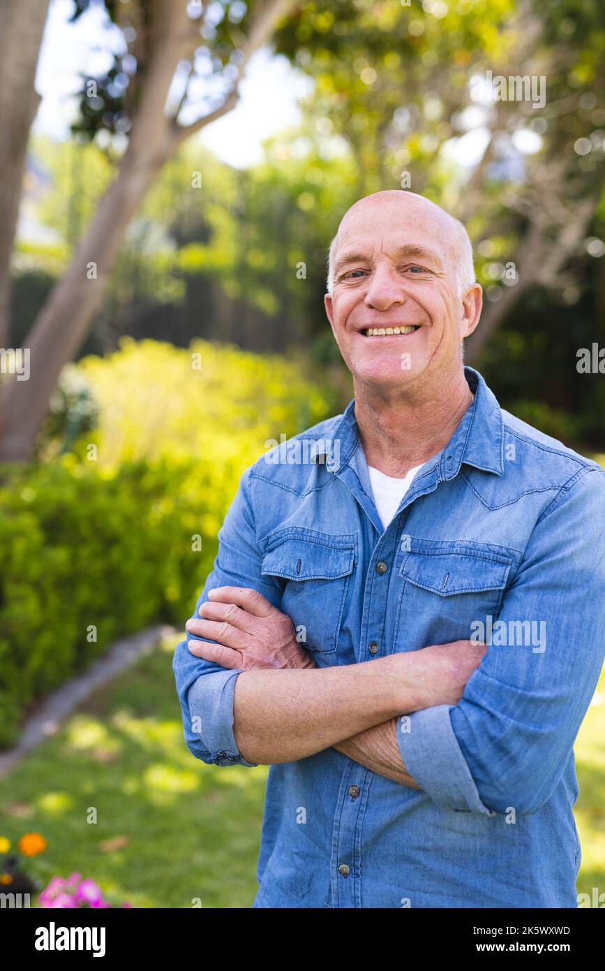 Vertical portrait of senior caucasian men wearing blue shirt and ...