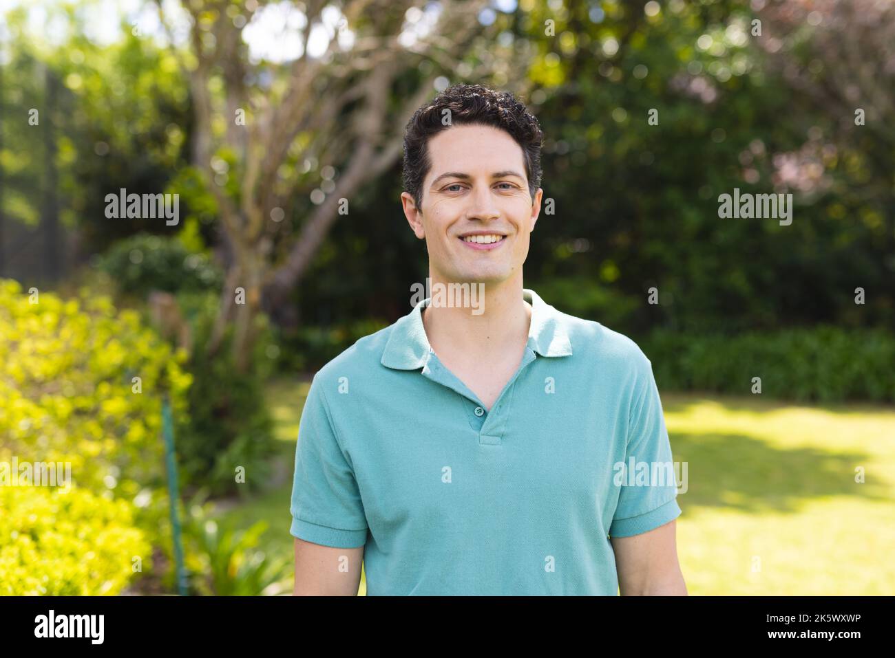 Portrait of young caucasian men wearing blue shirt and standing in the ...