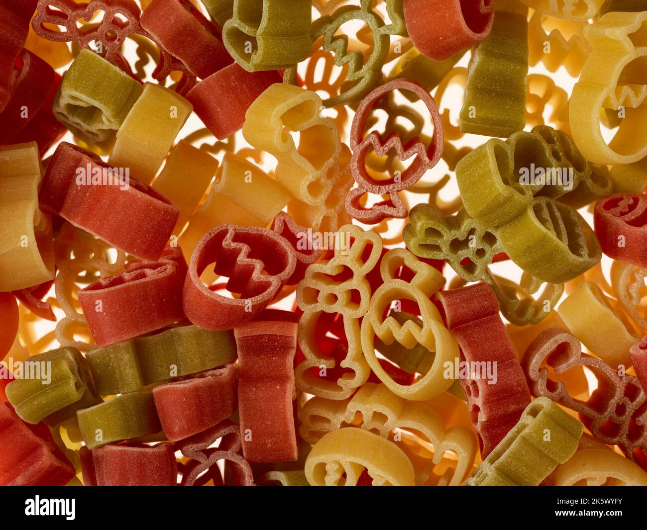 Food ingredient still-life of Tricolour, Easter Pasta Shapes in close ...
