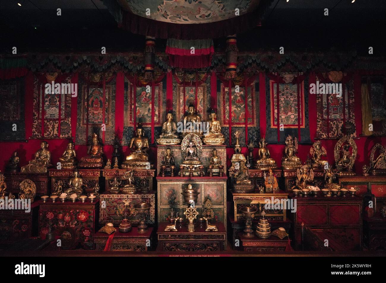 A Buddhist altar with many icons, statues, drawings and symbols Stock ...
