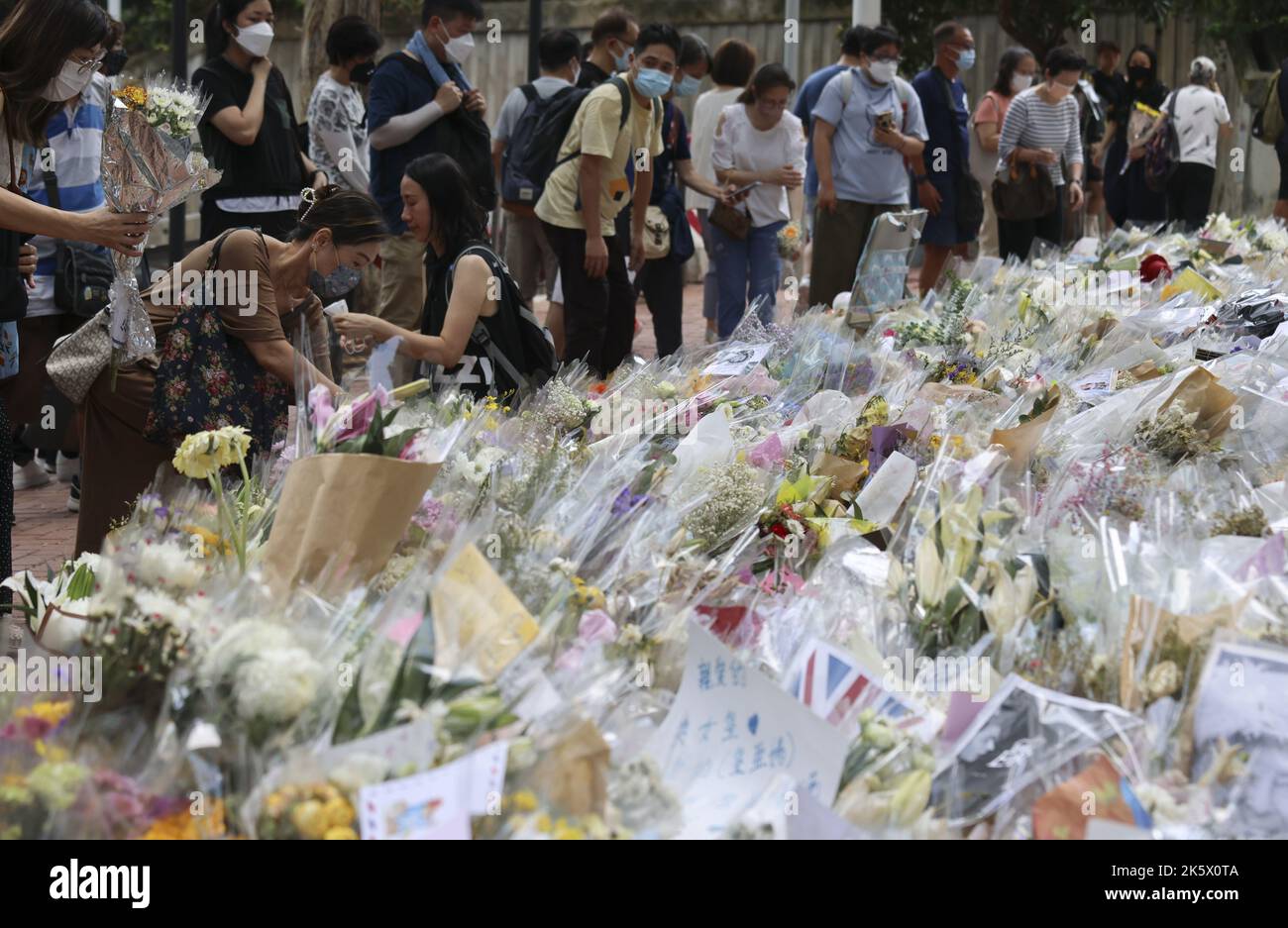 People leave floral tributes during Queen Elizabeth II's death is ...
