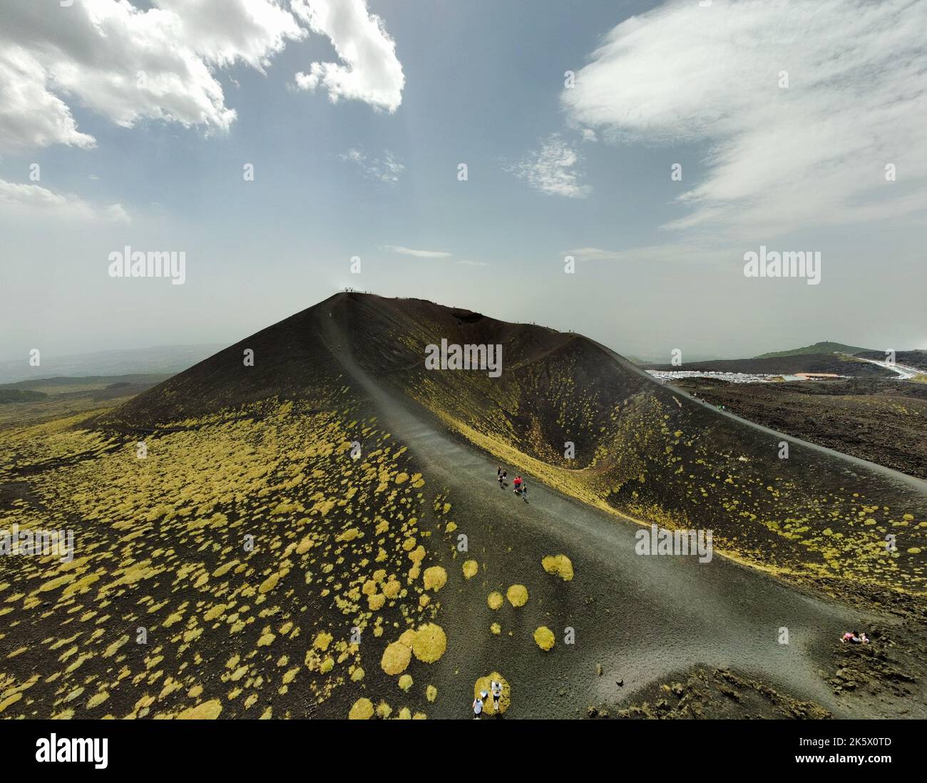 A landscape view of the highland and people riding bicycle Stock Photo - Alamy