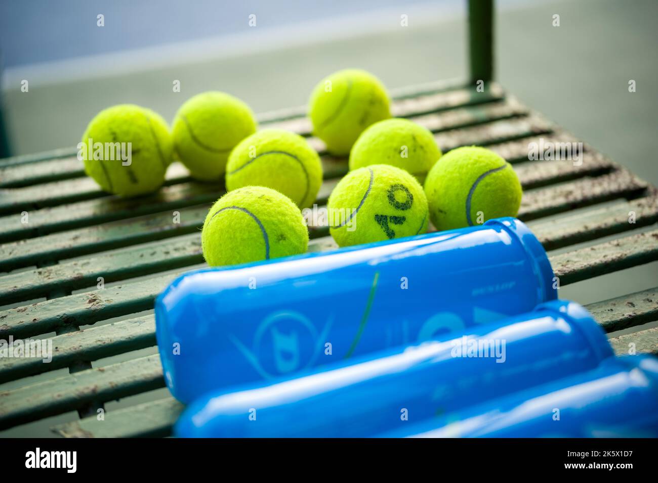A bunch of tennis balls set out ready to be played Stock Photo - Alamy