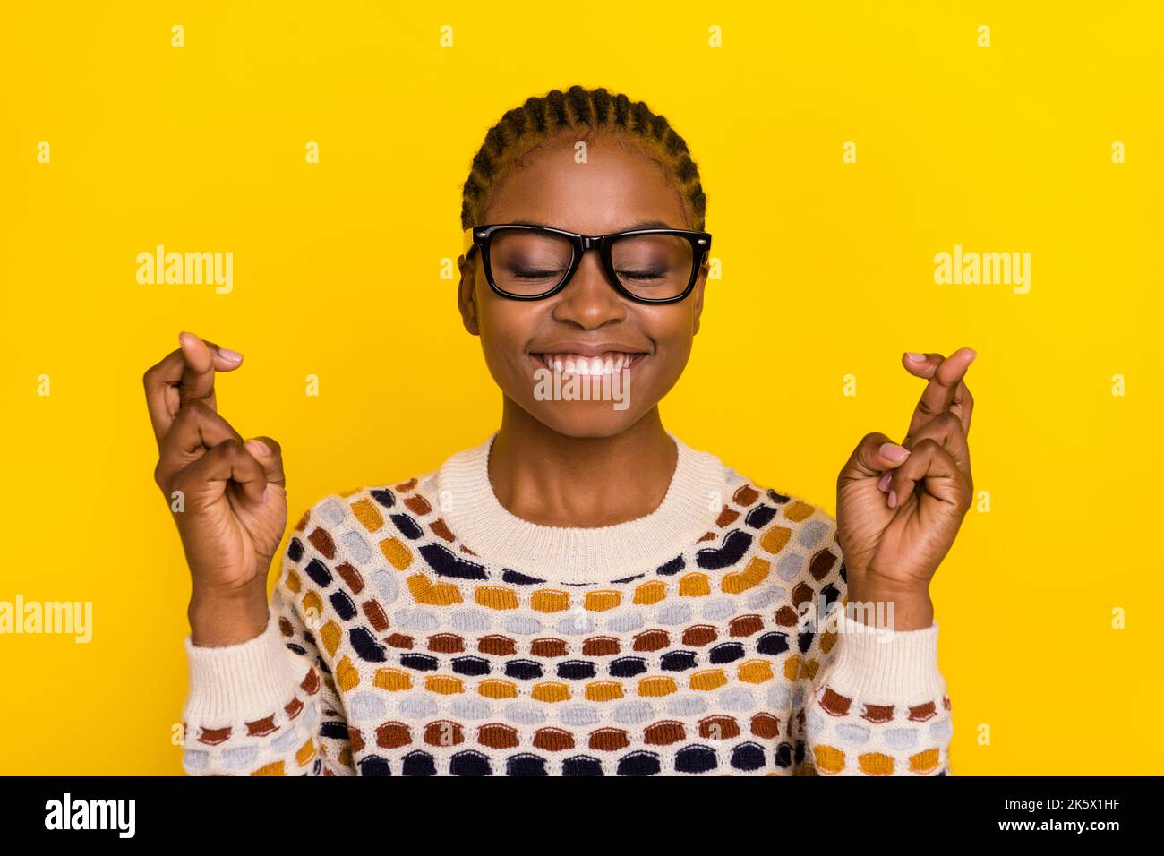 Portrait of hopeful lady hold fingers folded for god luck closed eyes ...