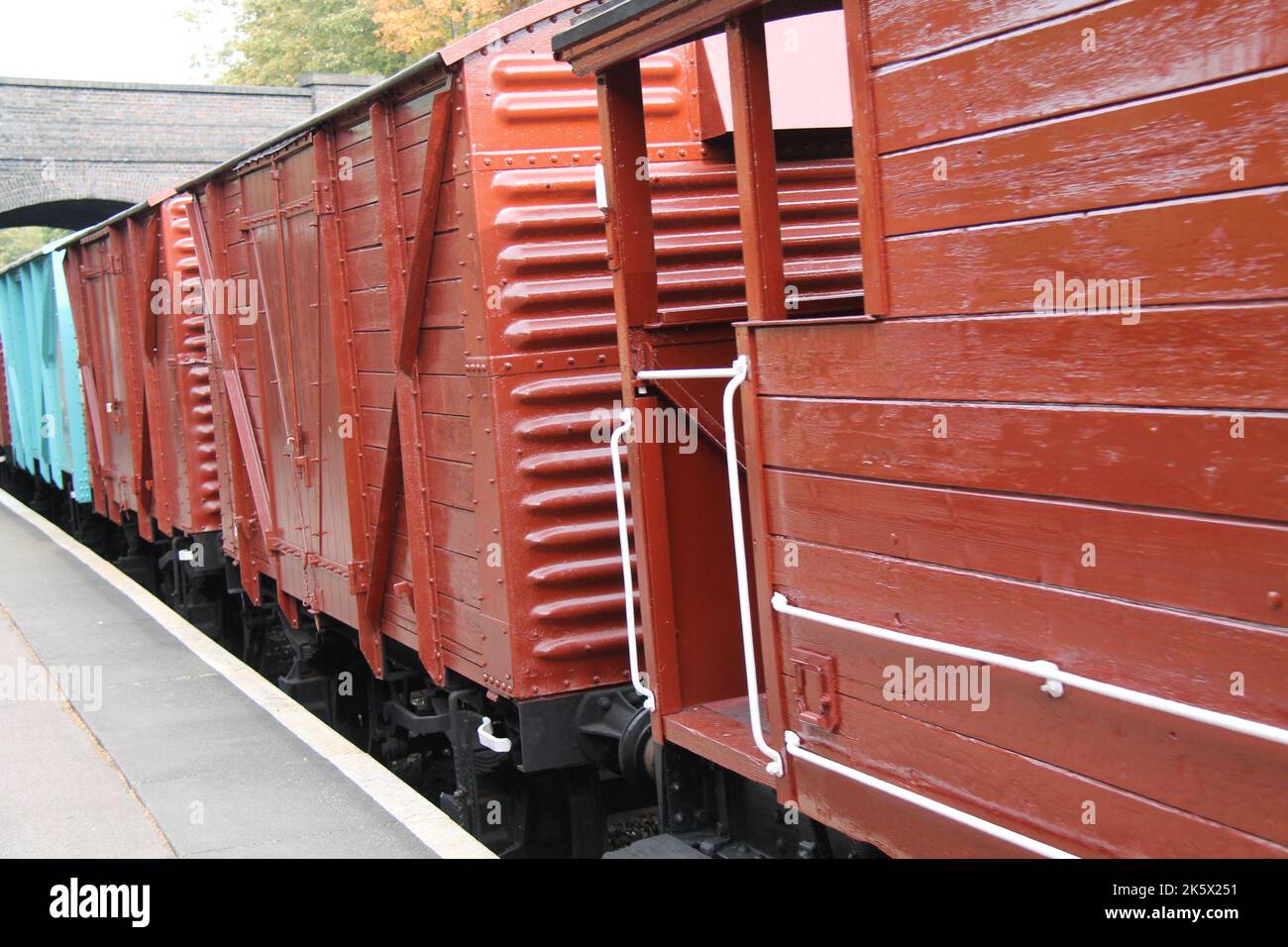 Vintage Railway Freight Wagons at a Station Platform Stock Photo - Alamy