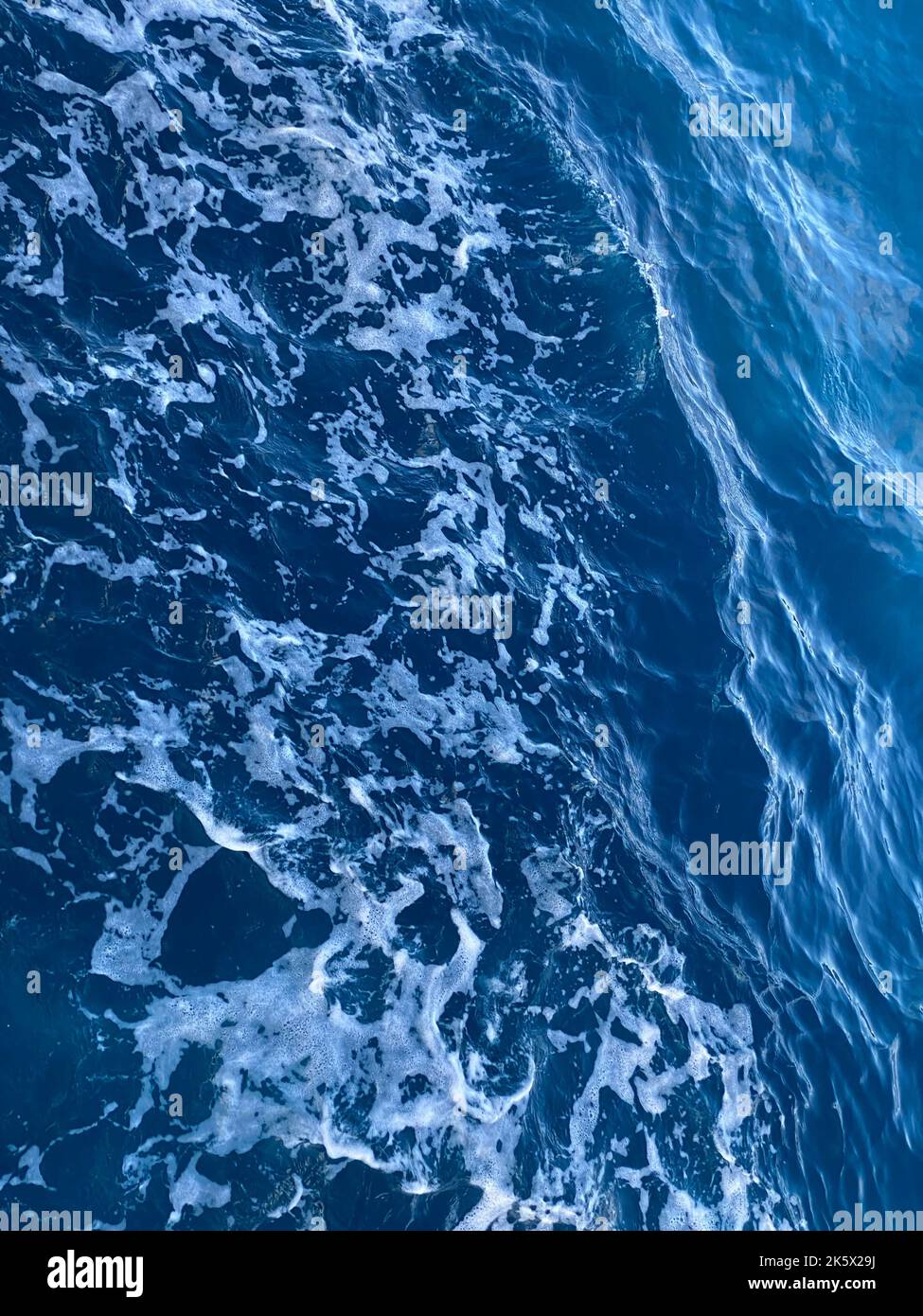 A vertical shot of foamy water surface Stock Photo - Alamy