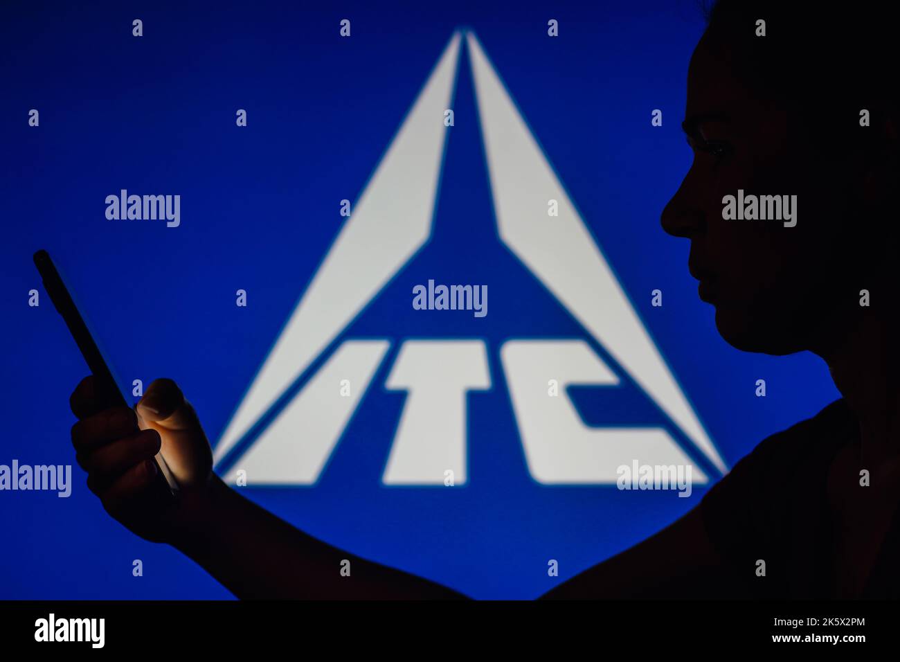 Brazil. 10th Oct, 2022. In this photo illustration, a woman's silhouette holds a smartphone with ...