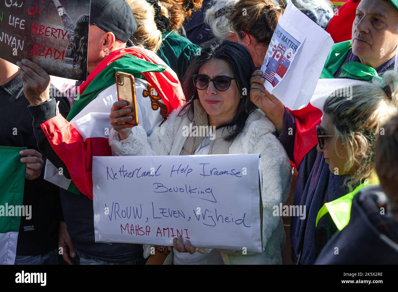 A protester holds a placard expressing her opinion during the ...