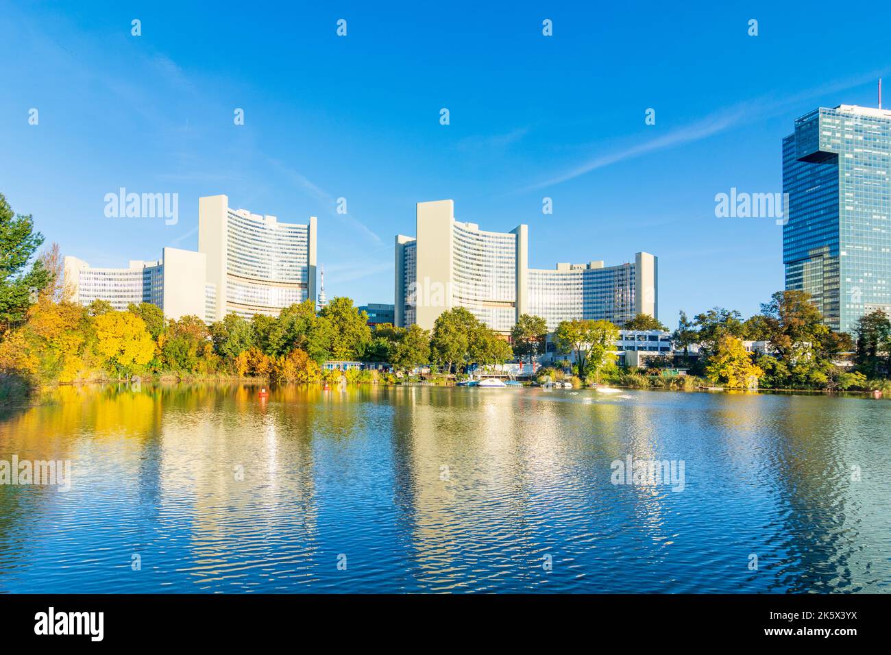 Wien, Vienna: oxbow lake Kaiserwasser in autumn colors, UN Building ...