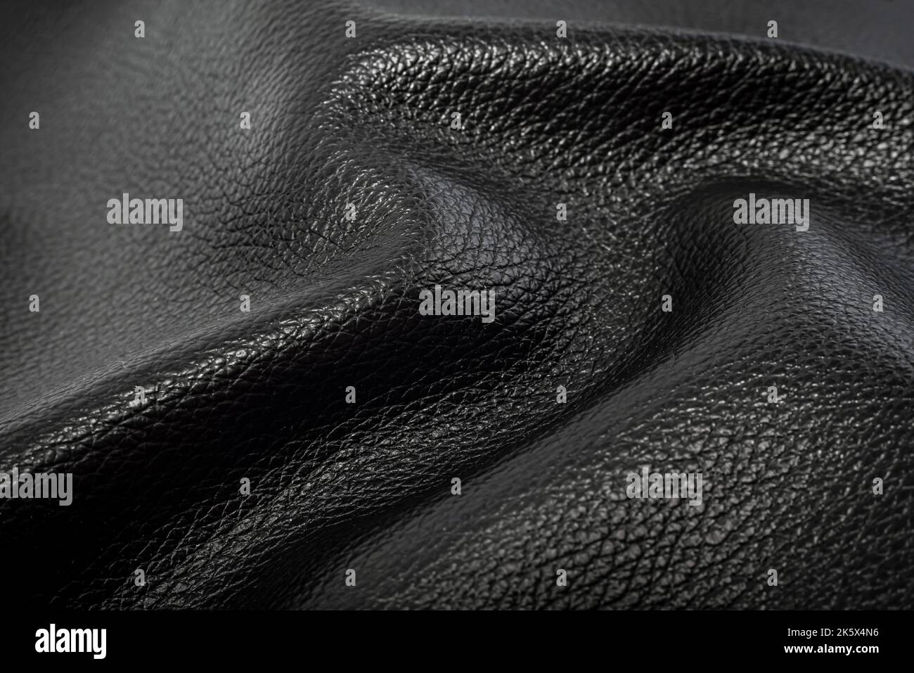 Black leather texture. Abstract background of dark leather with small ...
