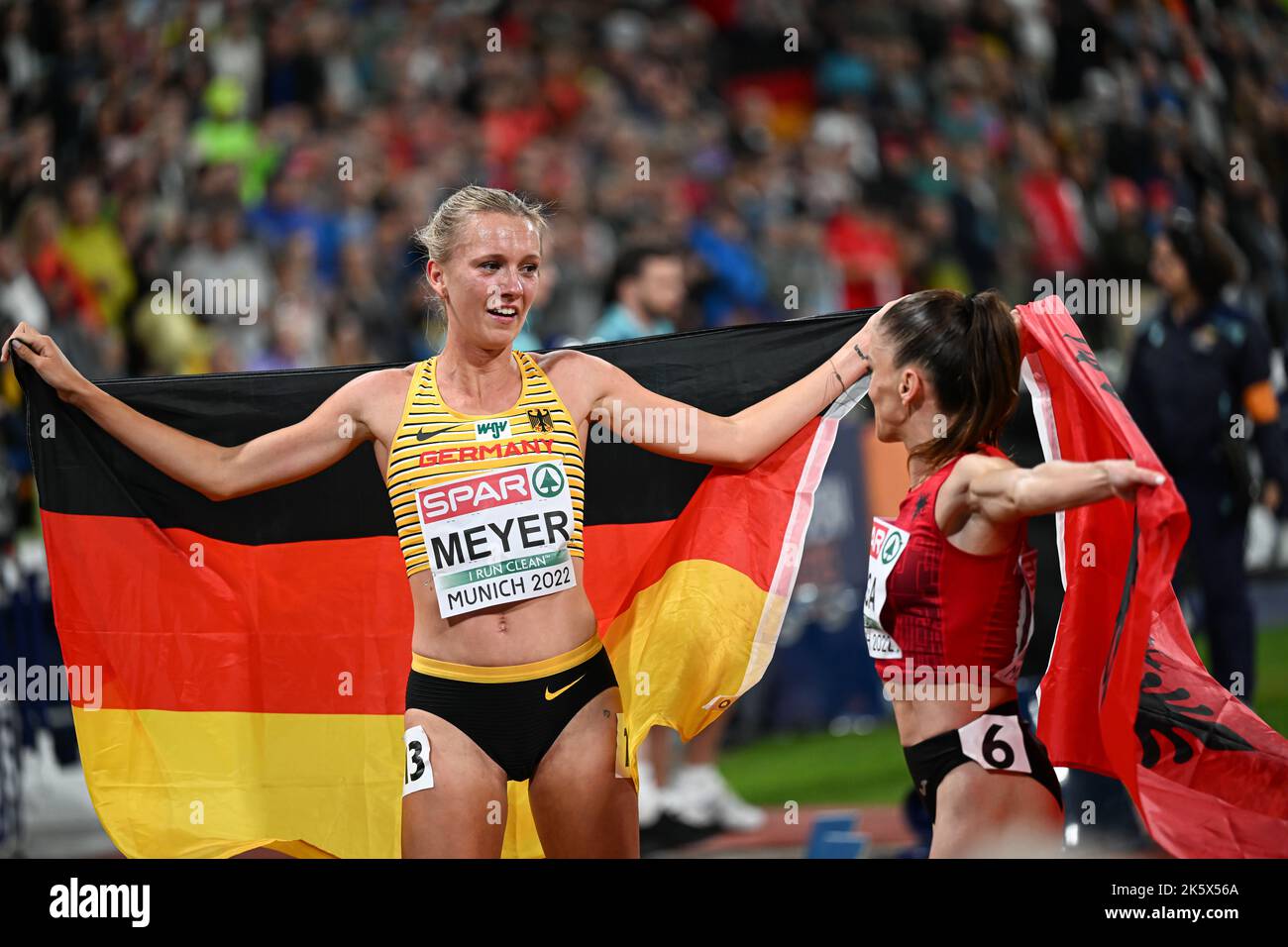 Lea Meyer and Luiza Gega with her country's flag of the 3000m ...