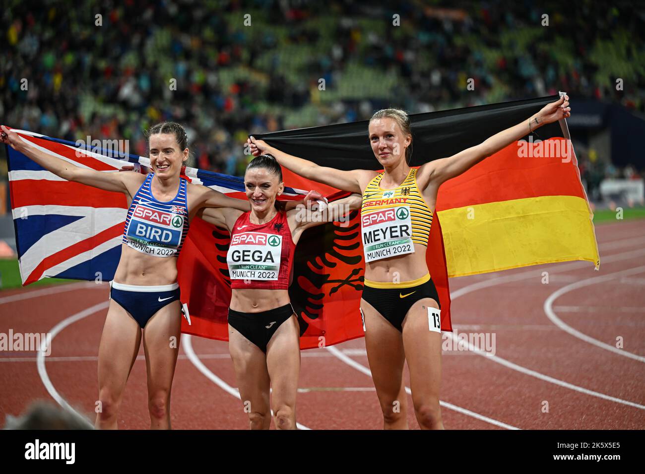 Lea Meyer, Luiza Gega and Elizabeth Bird with her country's flag of the ...