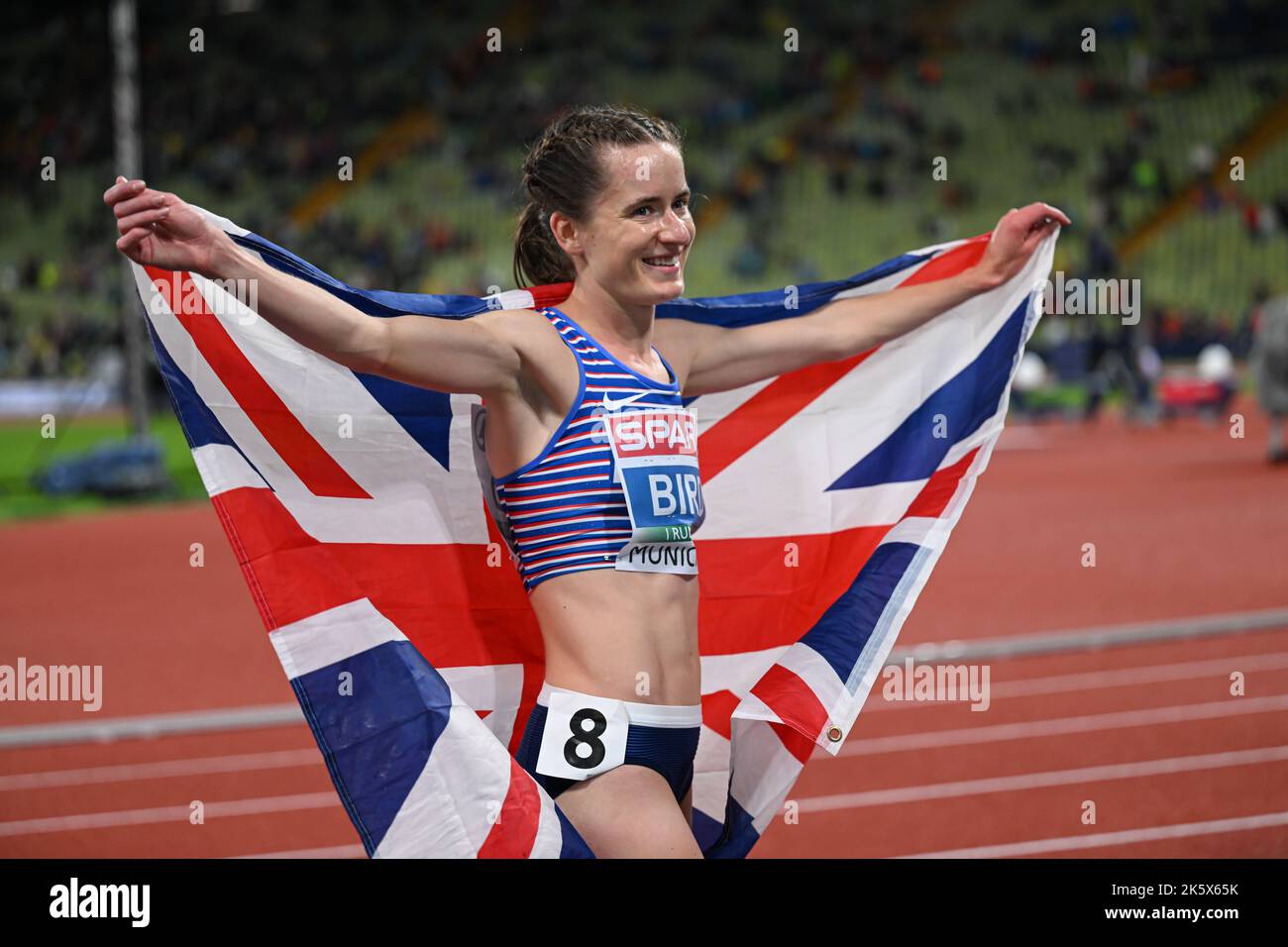 Elizabeth Bird with her country's flag of the 3000m steeplechase at the ...