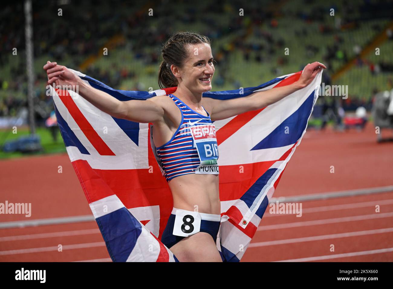 Elizabeth Bird with her country's flag of the 3000m steeplechase at the ...