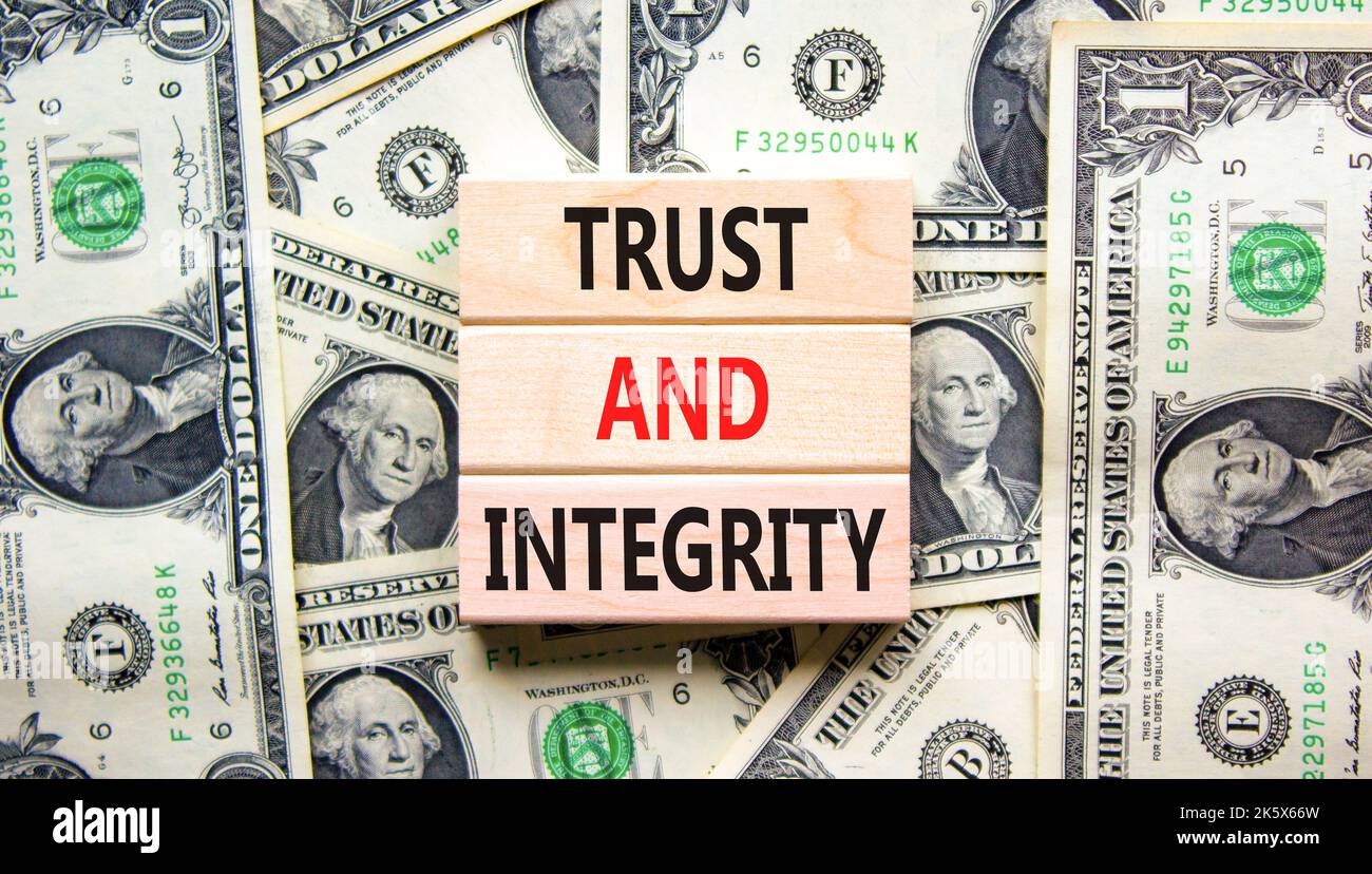 Trust and integrity symbol. Concept words Trust and integrity on wooden ...
