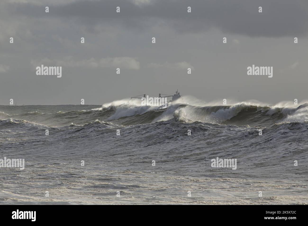 Long stormy wave seeing a ship on the horizon. Northern portuguese ...