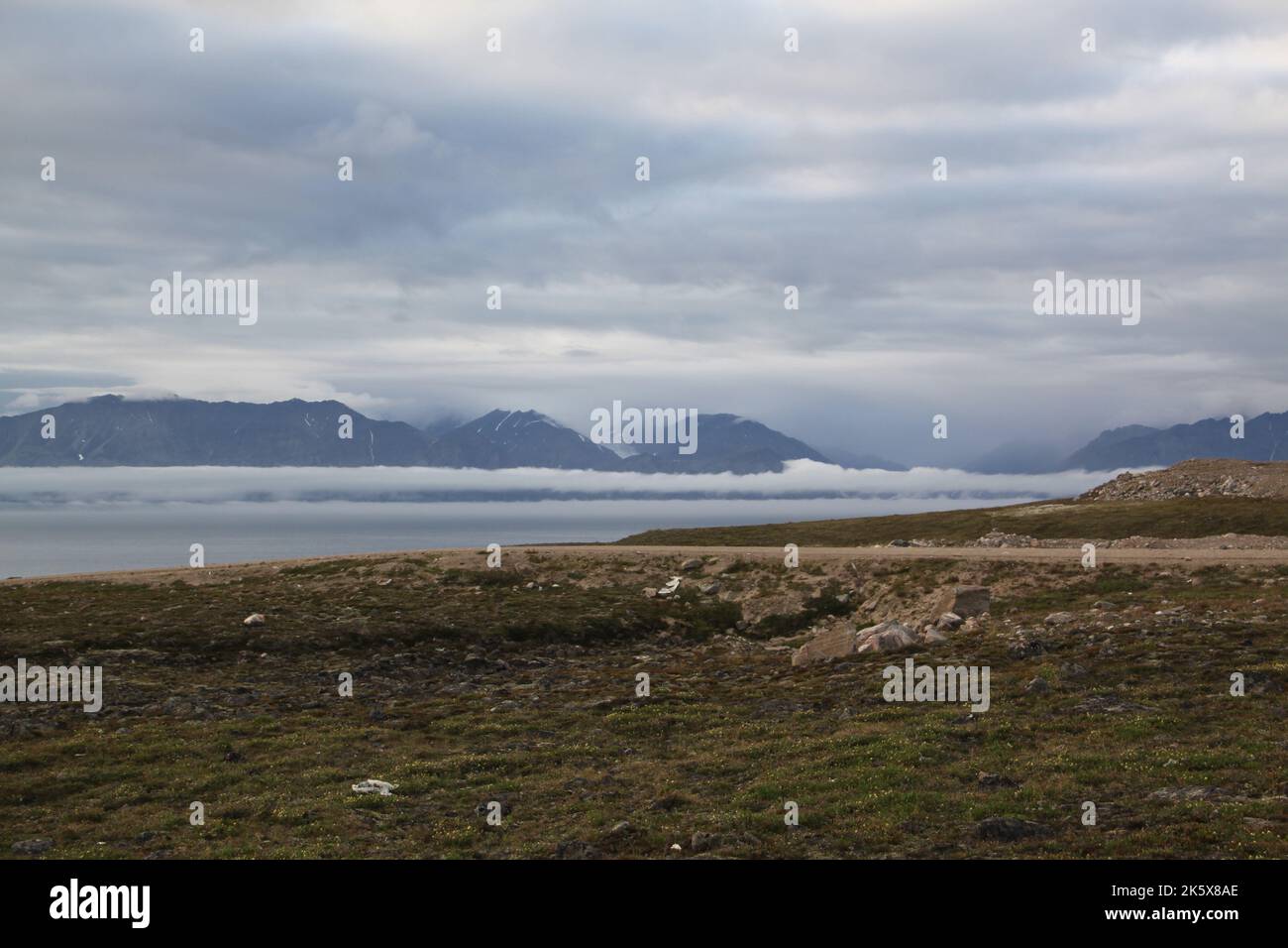 View of mountains across the bay from the community of Pond Inlet in ...