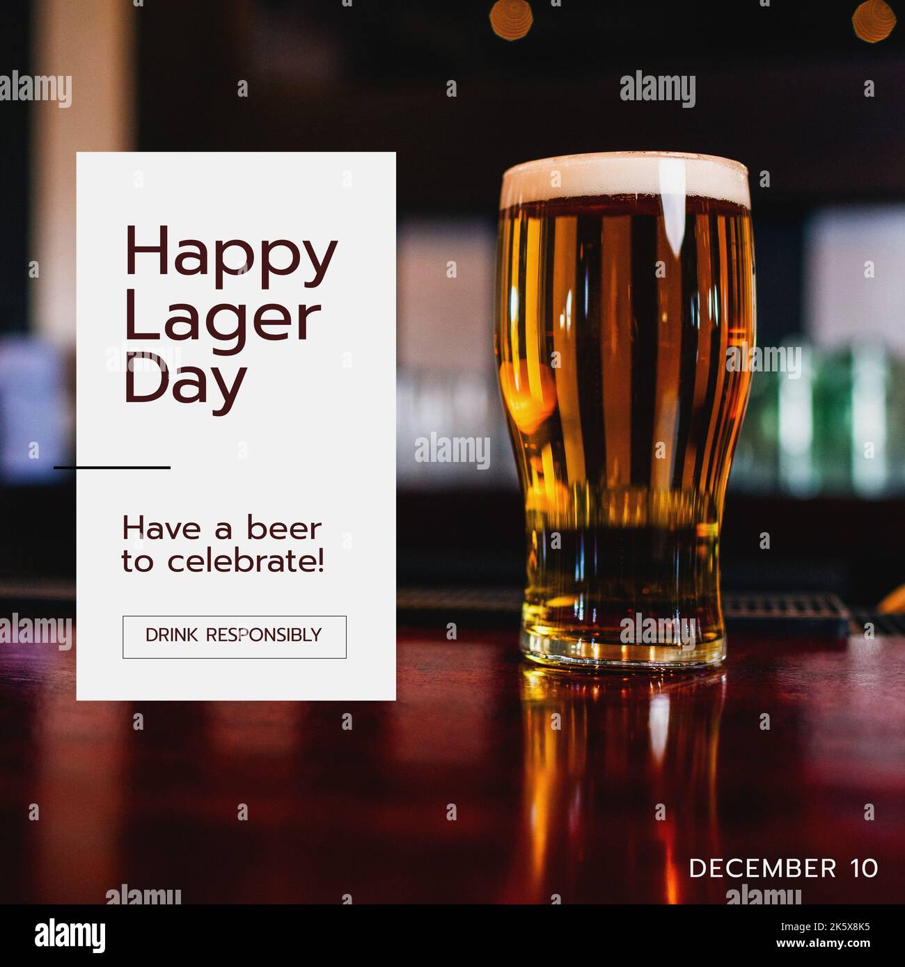 Composition of happy lager day text over beer in glass Stock Photo - Alamy
