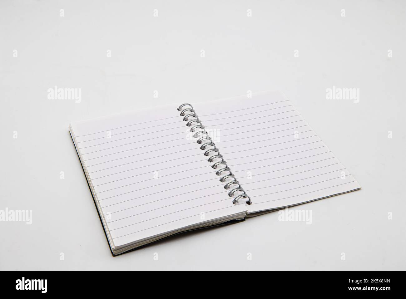 Open empty note book isolated on a white background Stock Photo - Alamy