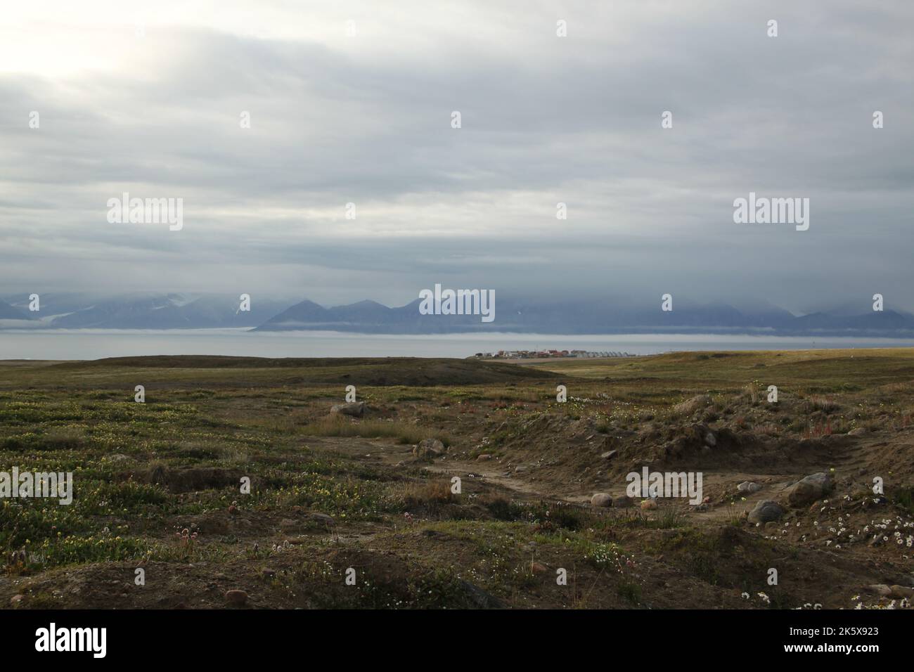 View of mountains across the bay from the community of Pond Inlet in ...