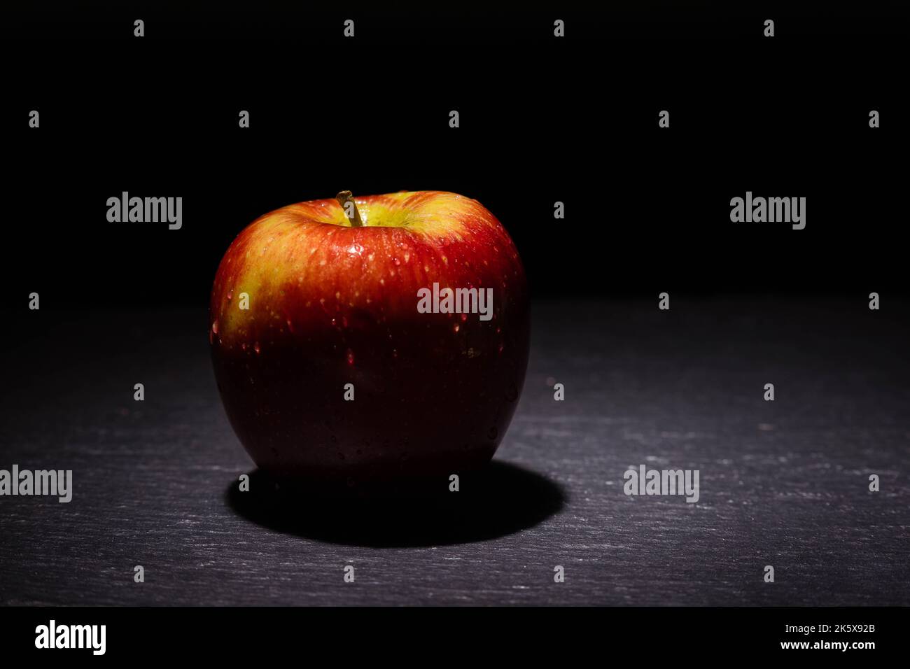 delicious wet apple with black background Stock Photo - Alamy